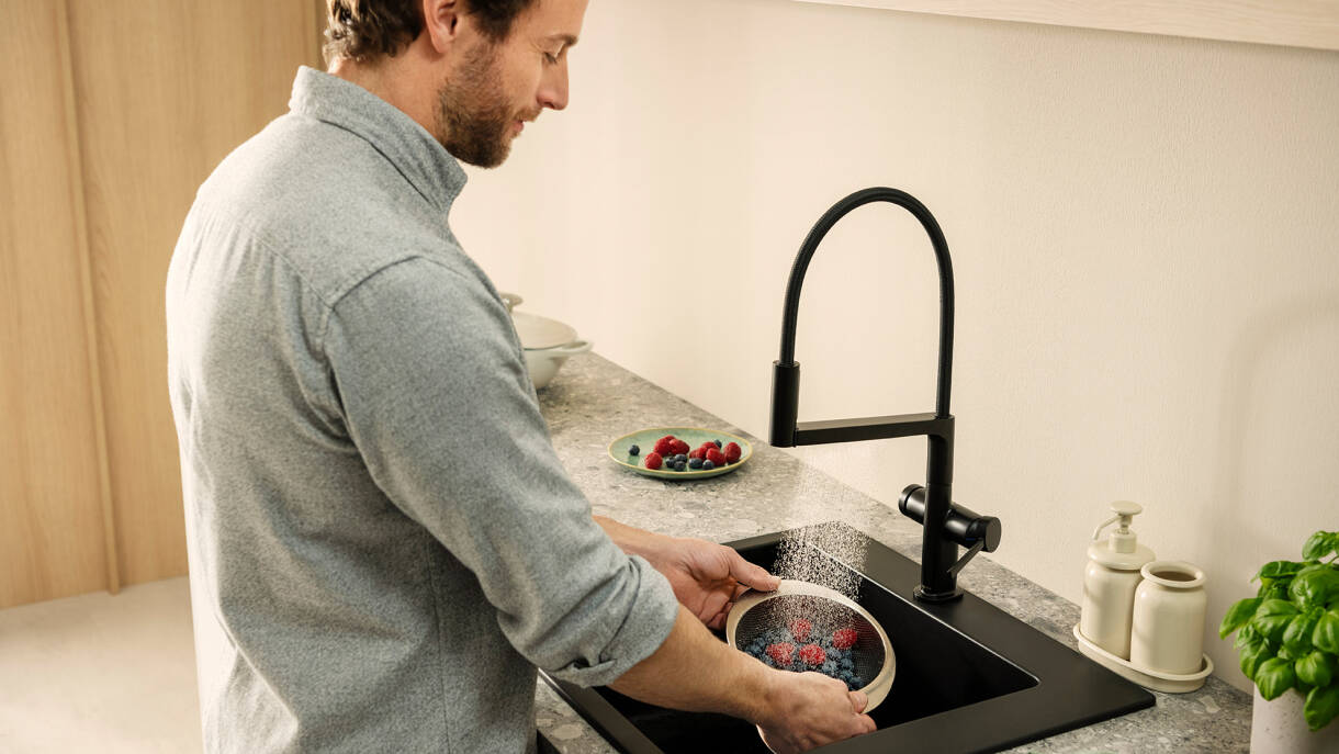 Kitchen faucet with three spray modes.