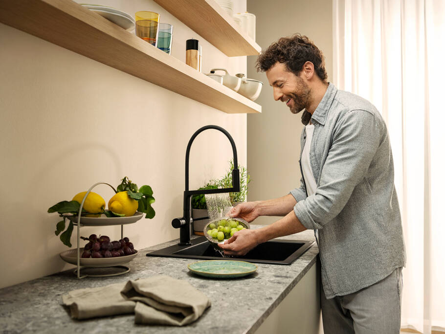 Kitchen faucet with three spray modes.