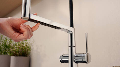 Kitchen faucet with three spray modes.